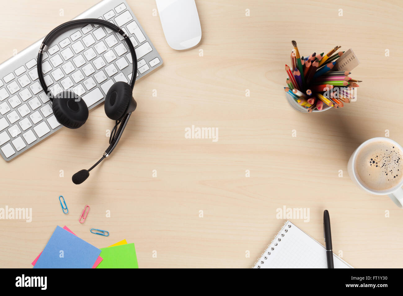 Office desk with headset, notepad and pc. Call center support table ...