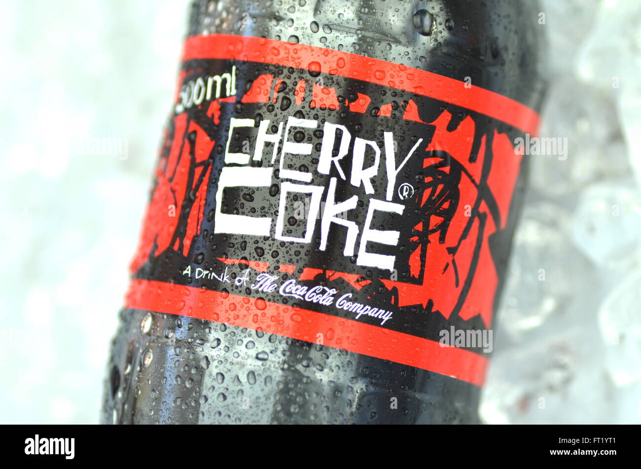 Cherry Coke drink on ice cubes Stock Photo - Alamy