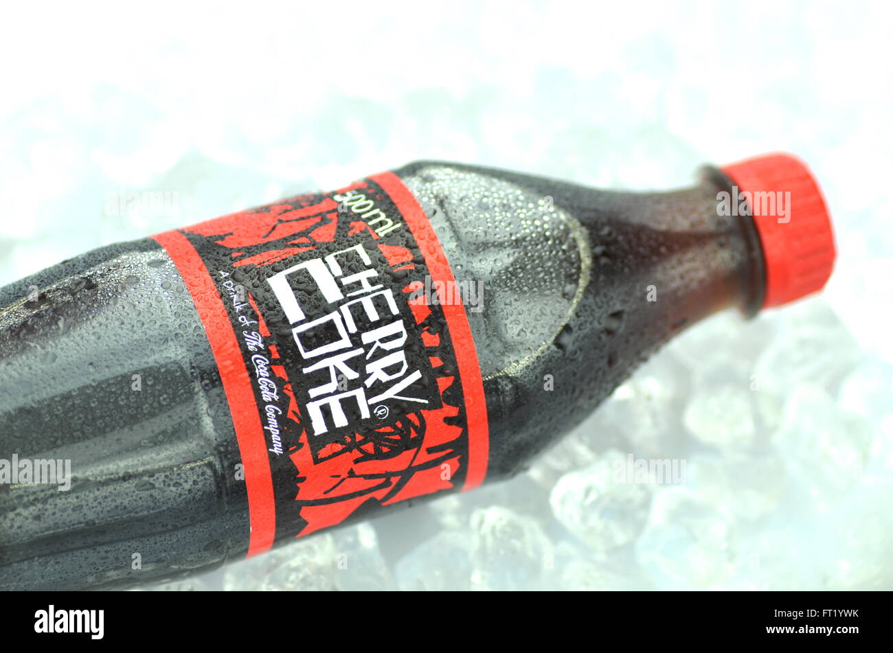 Cherry Coke drink on ice cubes Stock Photo - Alamy