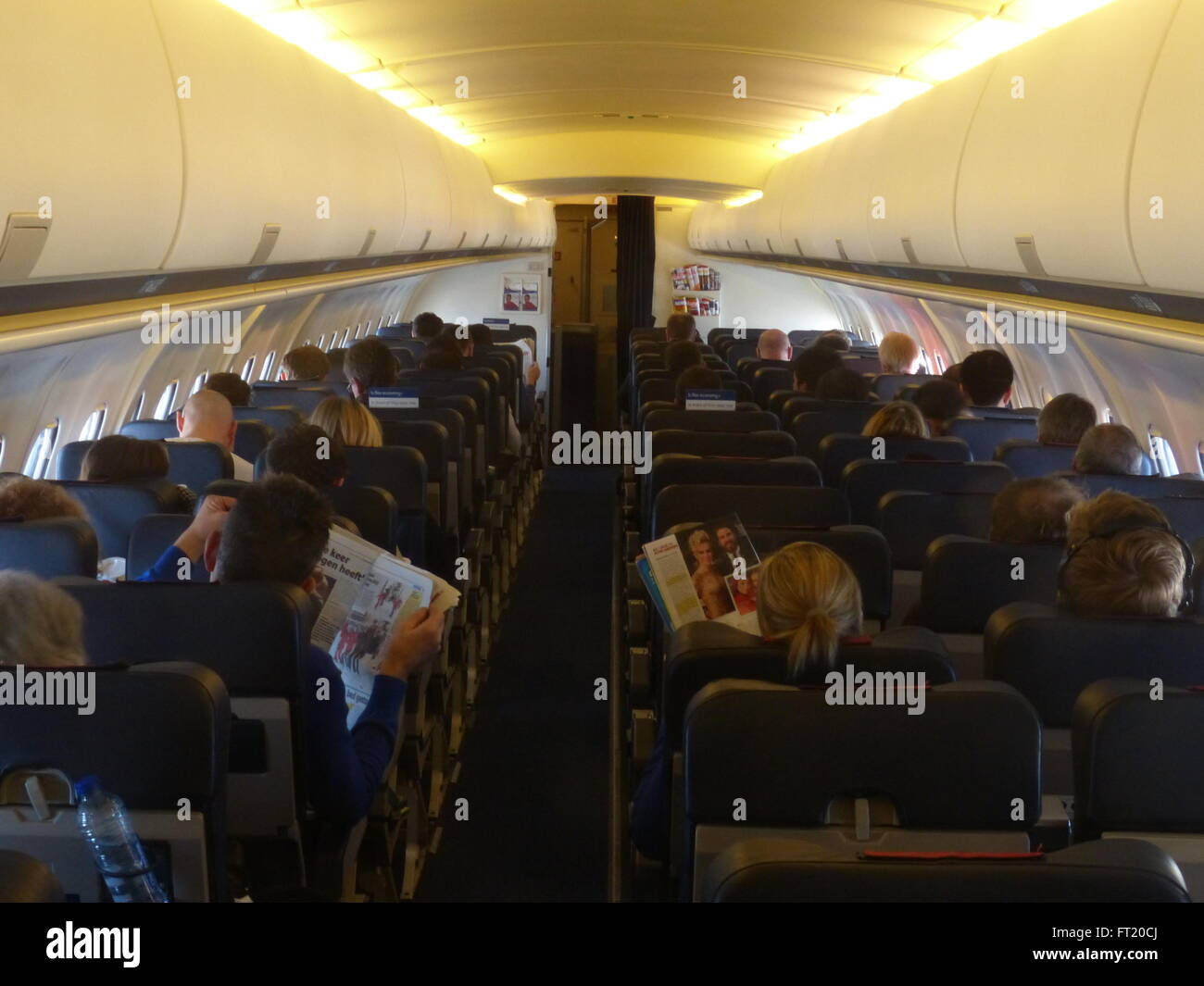 Aircraft interior, passengers Stock Photo - Alamy