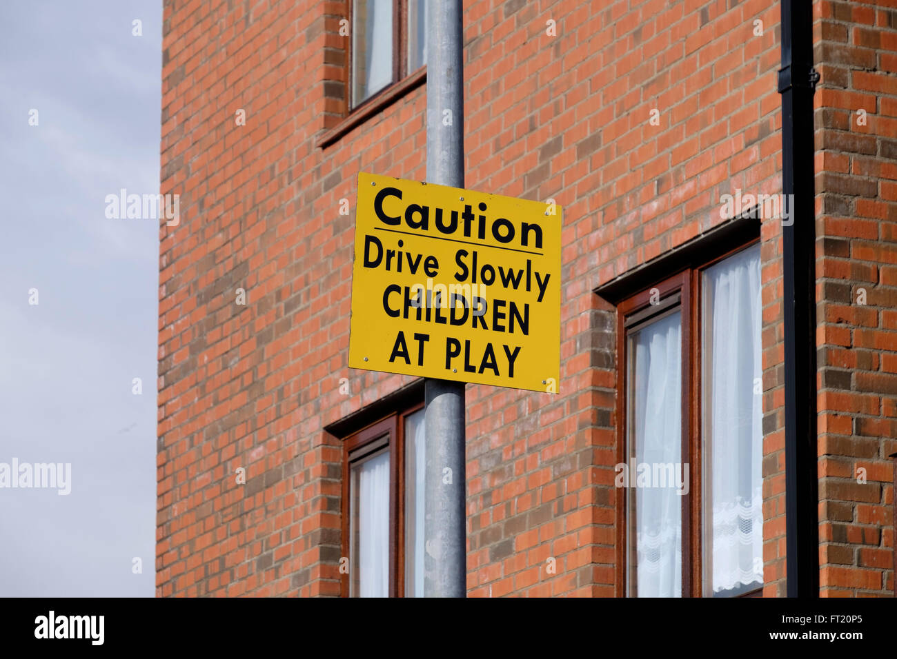 "Drive slowly children at play" caution sign Stock Photo - Alamy