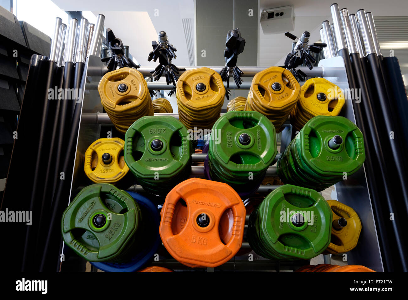 Colorful Reebok weights at gym Stock Photo - Alamy