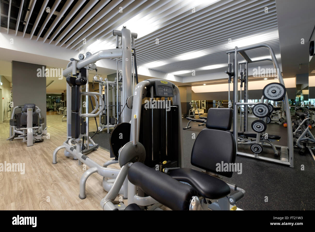 Equipment at an empty gym Stock Photo - Alamy