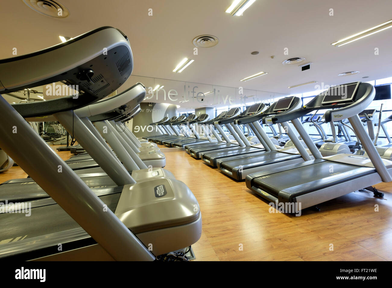 Rows of vacant treadmills at an empty gym Stock Photo - Alamy