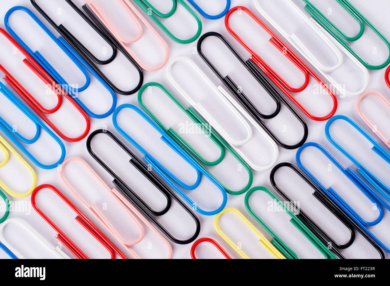 Colourful paperclips lined up Stock Photo - Alamy
