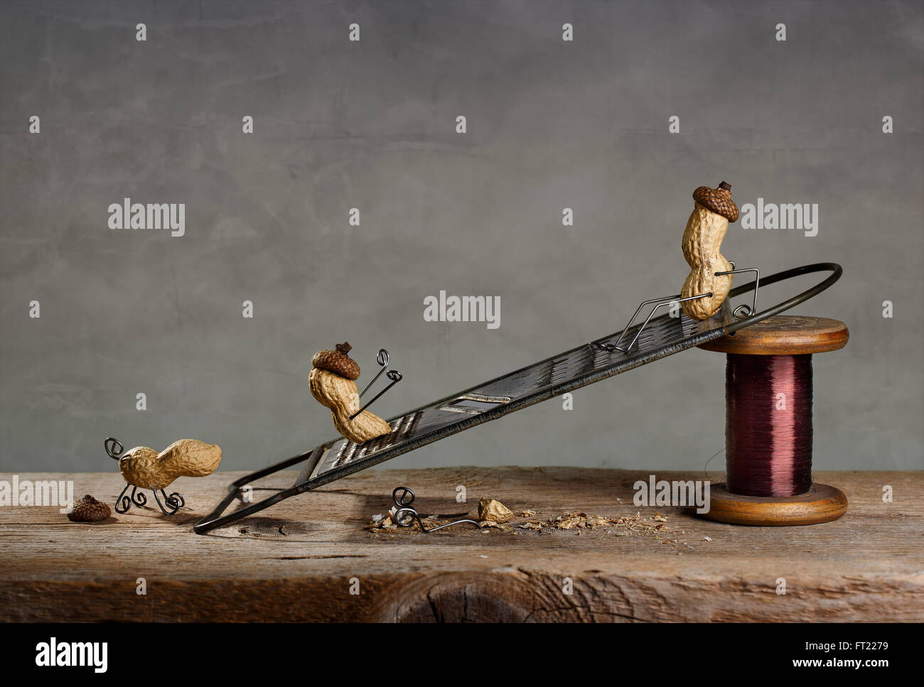 Simple Things series - Peanut men sliding down on Slice Cutter Stock ...