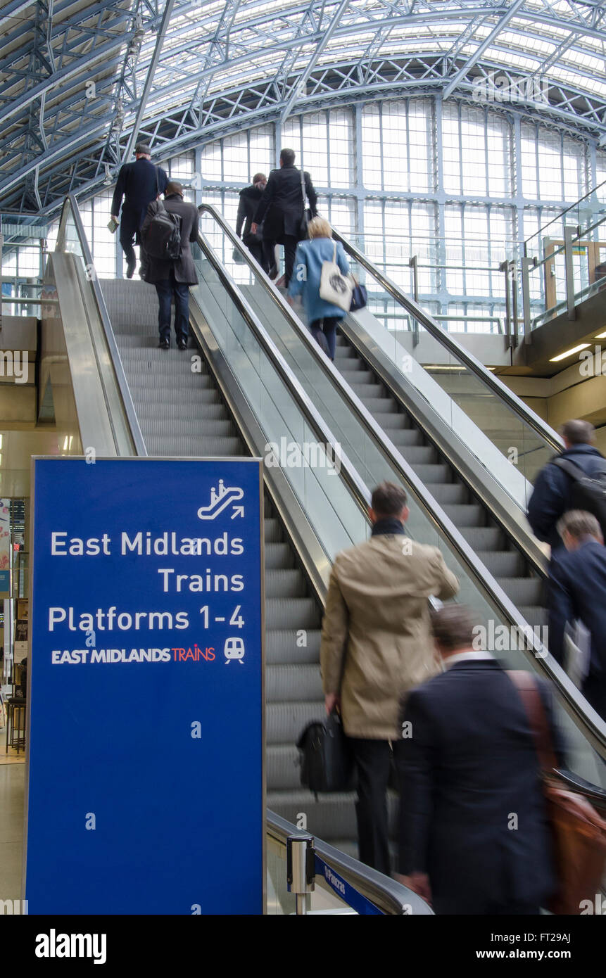Passengers going up escalators leading to platforms 1 - 4 at St Pancras ...