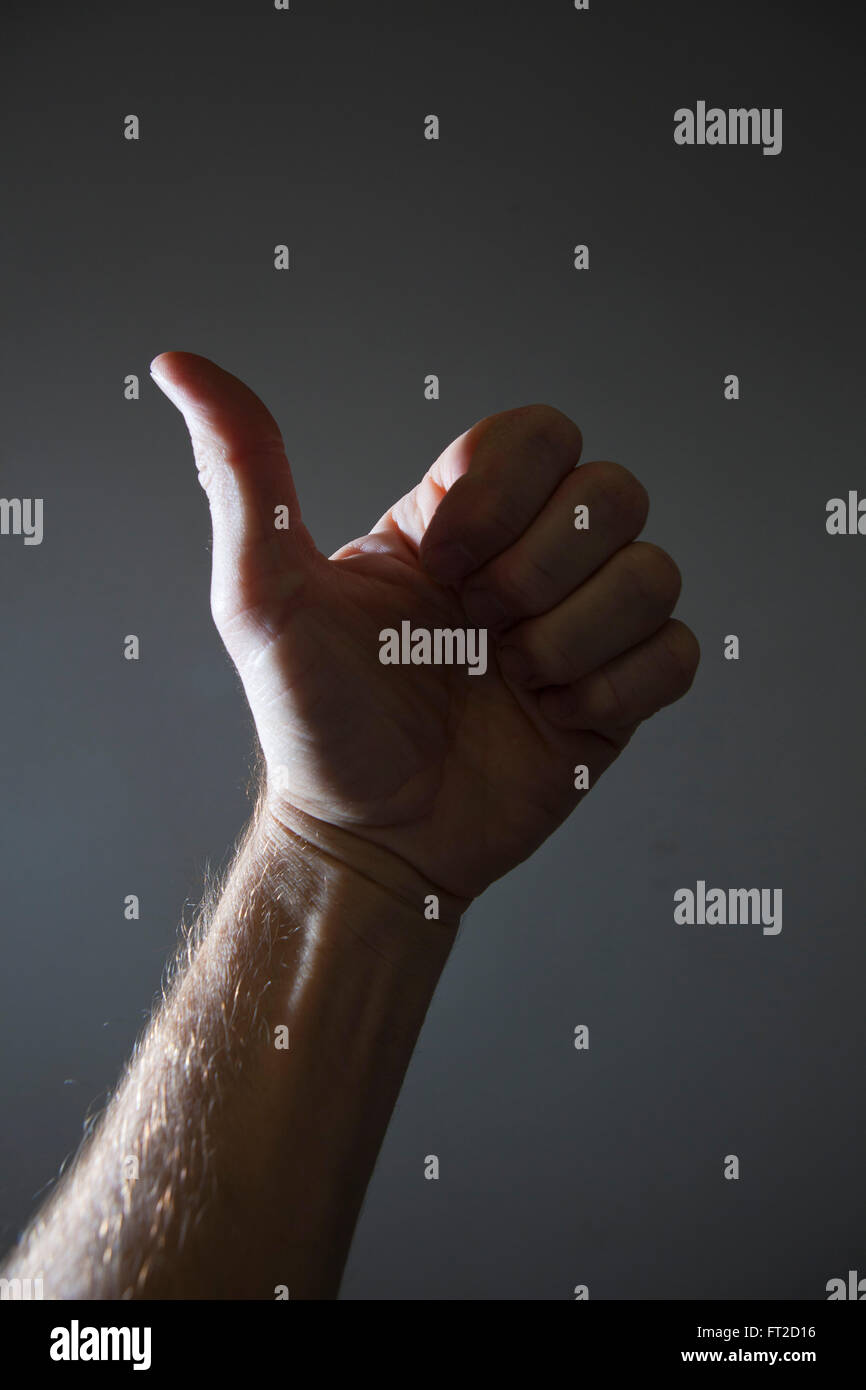 A hand probably male making a hadn sign universal understood around the ...