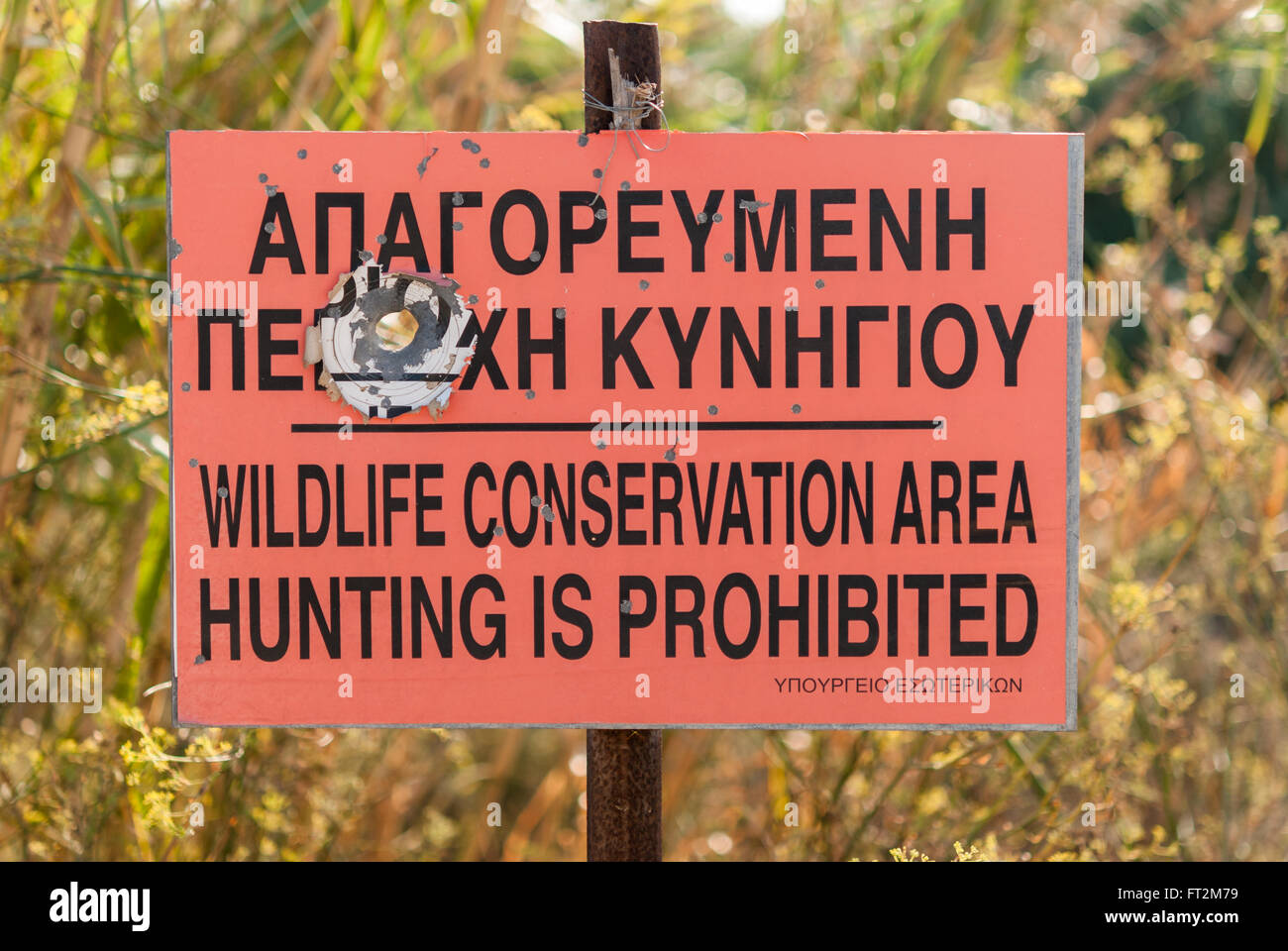 Hunting prohibited sign with bullet holes. Alaminos. Cyprus Stock Photo ...