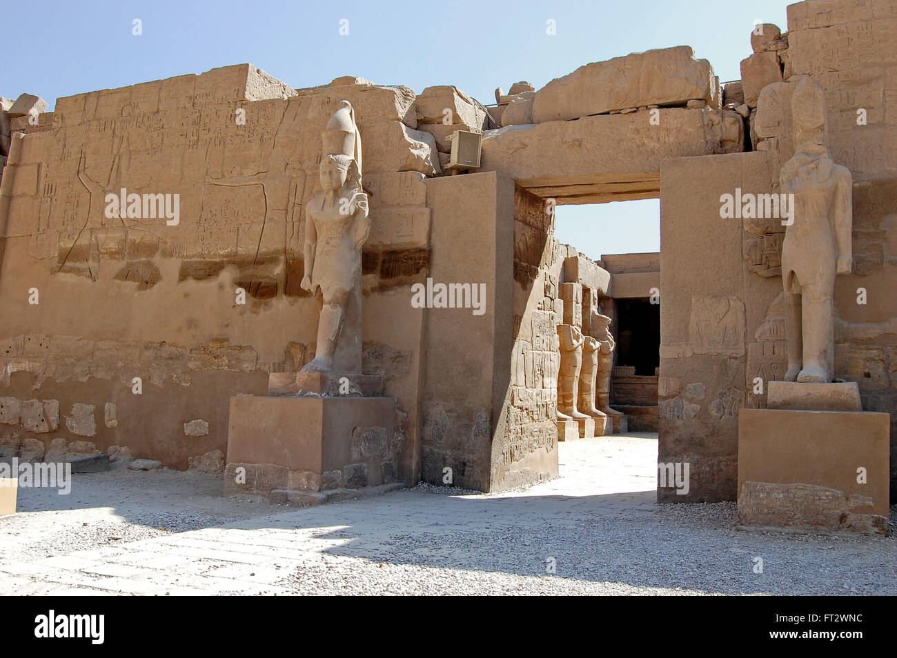 Stone statues guard the entrance to a temple at Karnak, Luxor Egypt ...