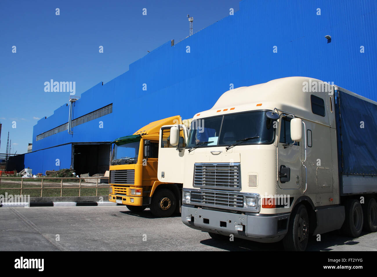 Two powerful lorries at a modern factory Stock Photo - Alamy
