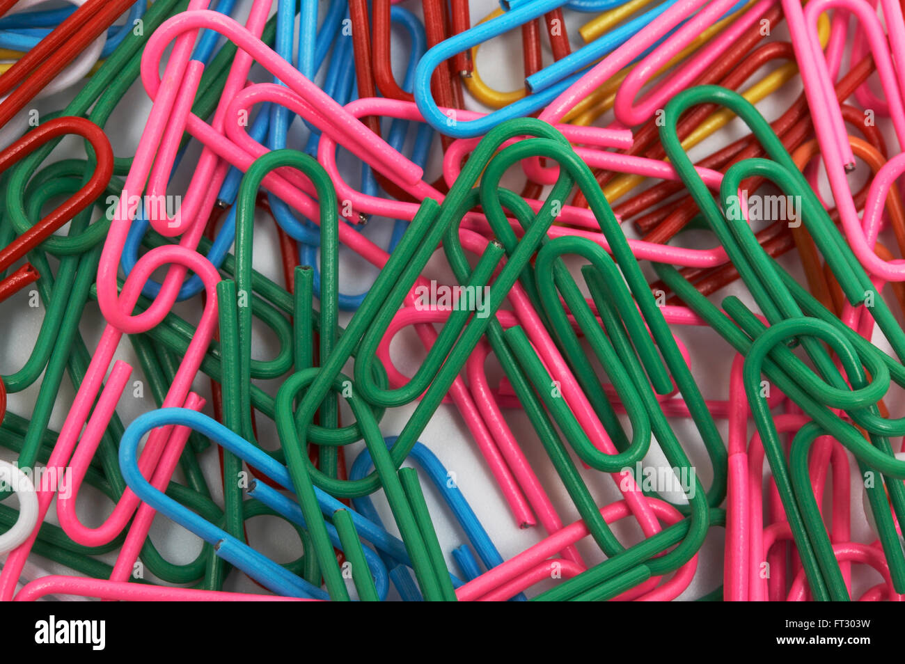Beautiful color paper clips as a background Stock Photo - Alamy