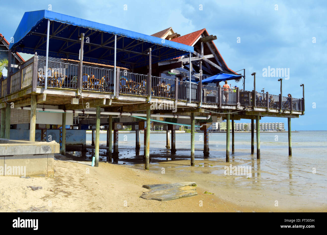 Restaurant on stilts on Ben T Davis Beach Stock Photo - Alamy