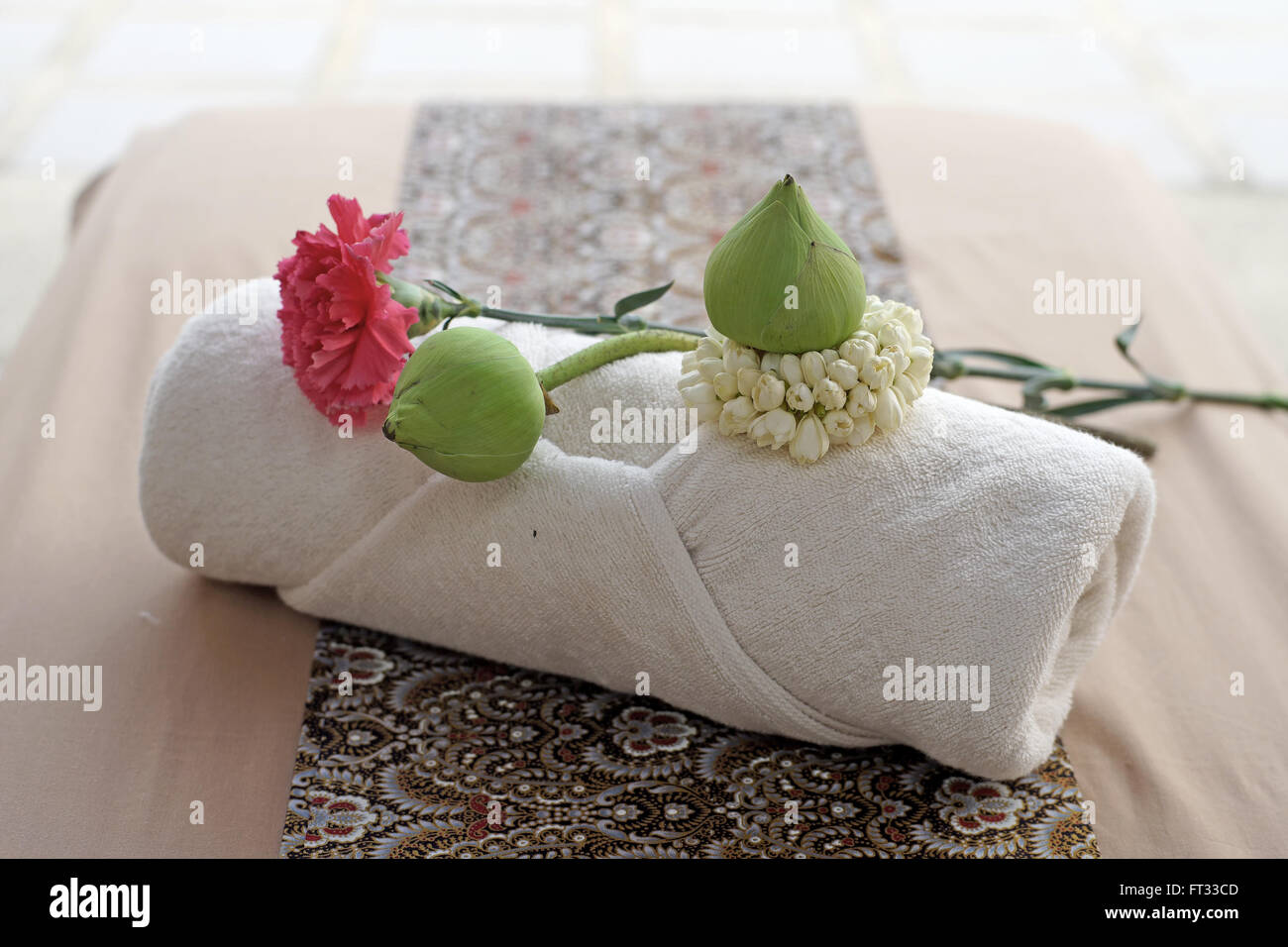 lotus jasmine and carnation flower on white bath towel Stock Photo - Alamy