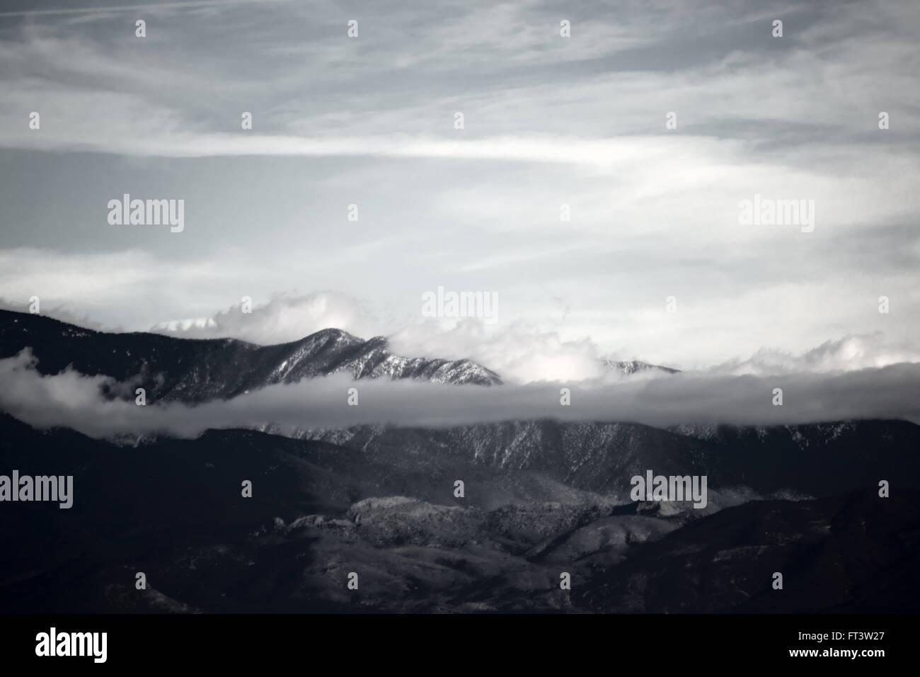 Clouds over the mountains Stock Photo - Alamy