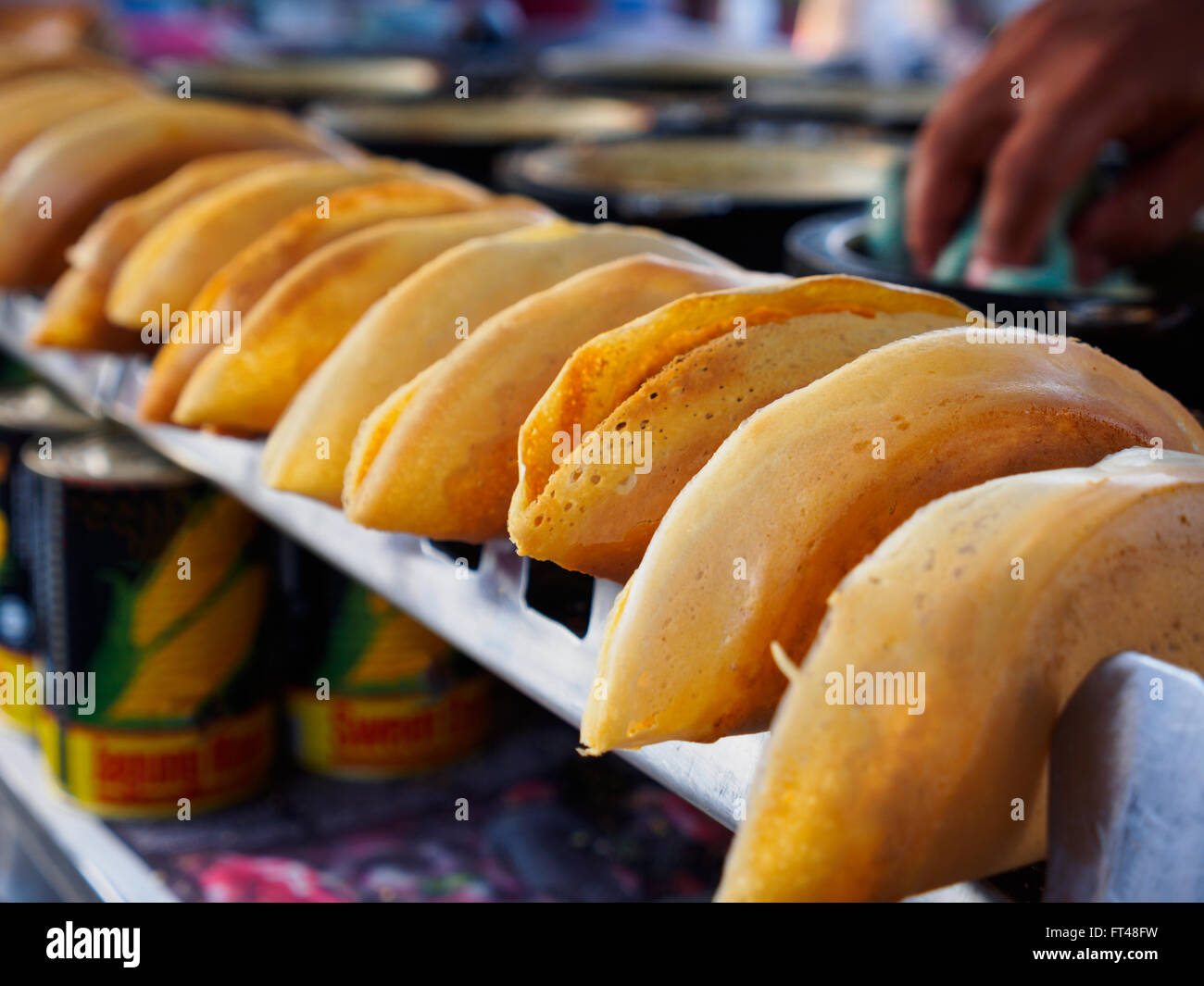 Sweet local pancakes for sale at a stall in a traditional night market ...