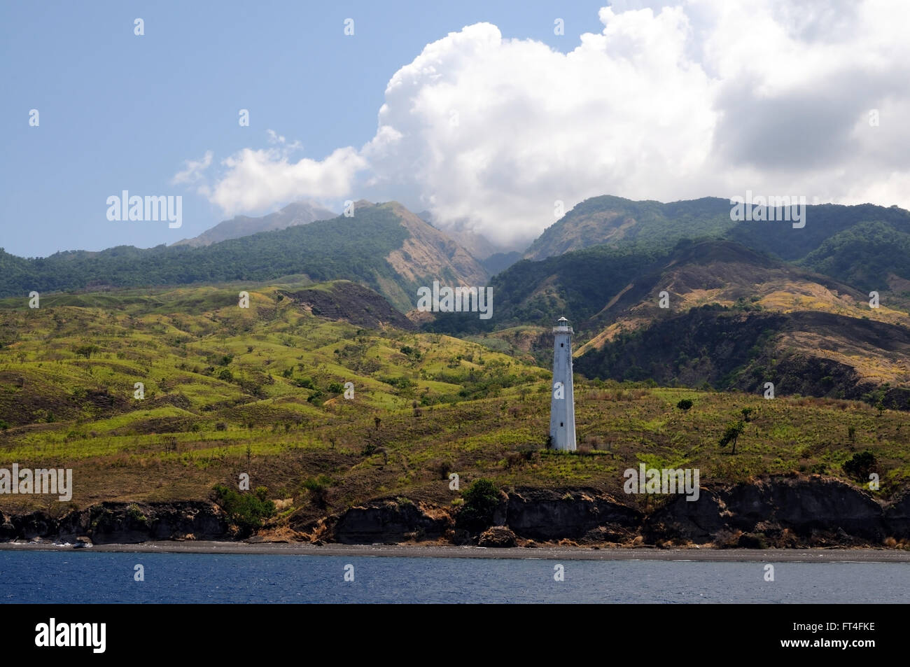 Lighthouse on volcanic island, Komodo area, Indonesia Stock Photo - Alamy