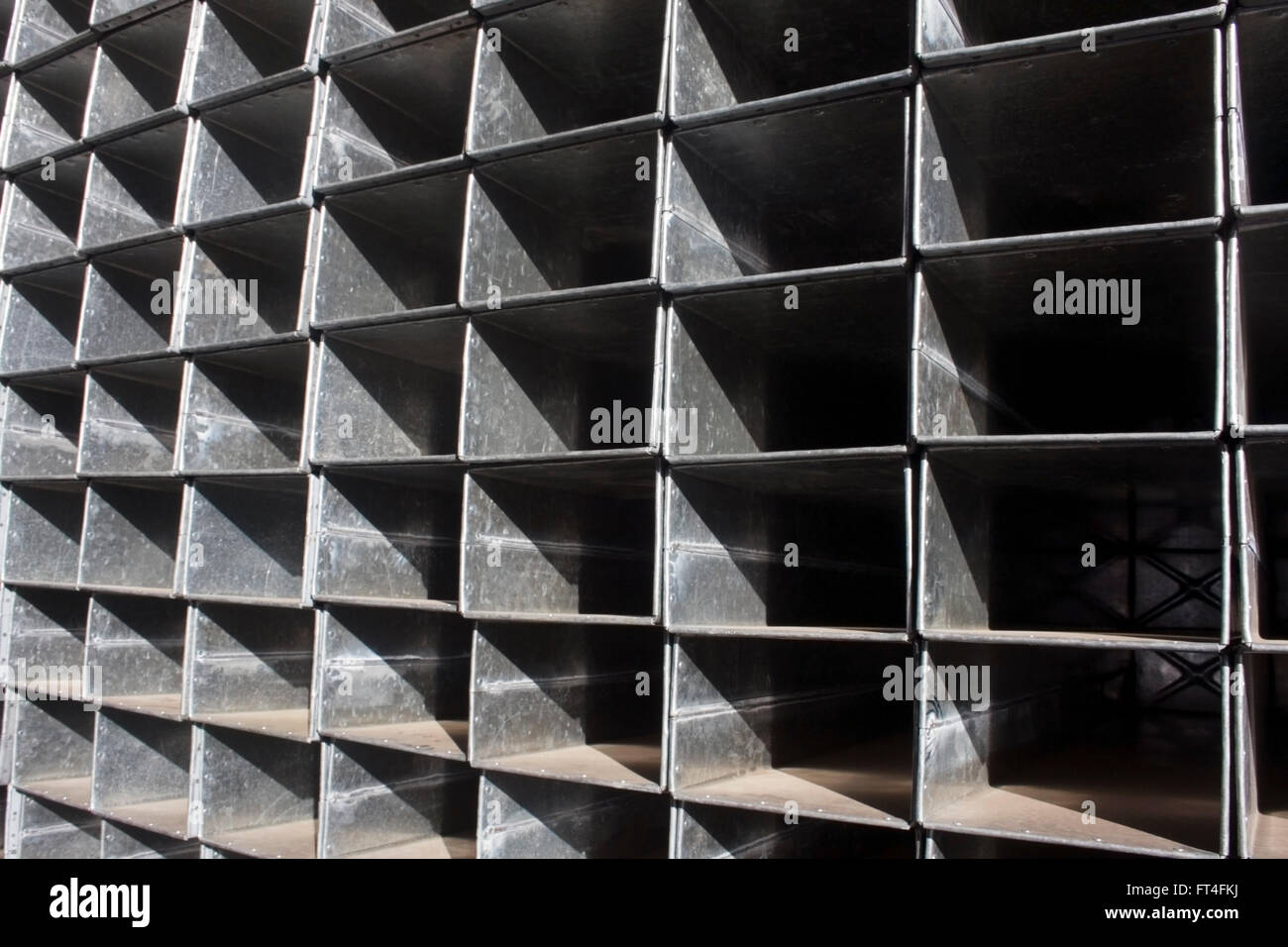 Manufactured sheet metal cubes are stacked at the Im Chheng factory in ...