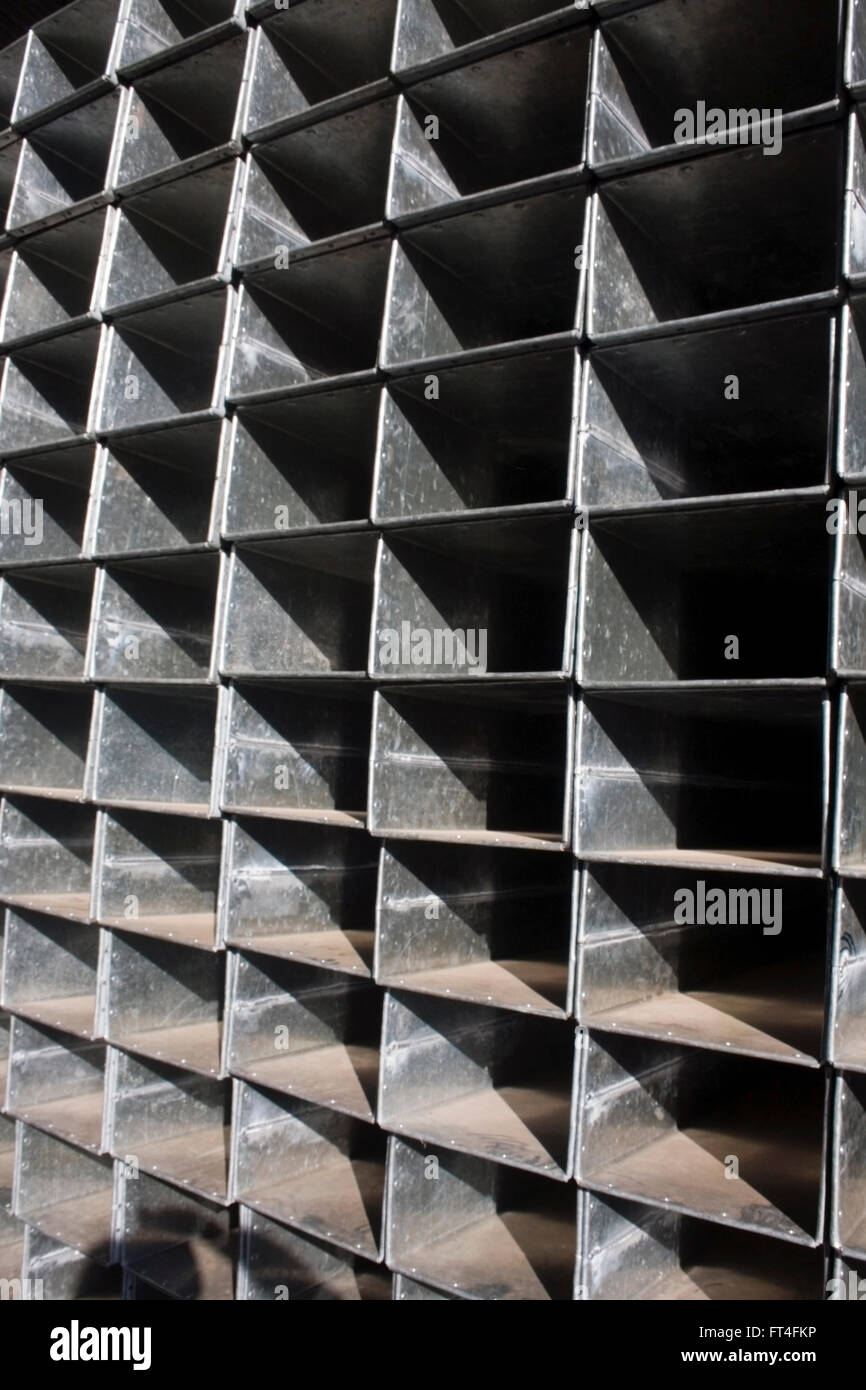 Manufactured sheet metal cubes are stacked at the Im Chheng factory in ...