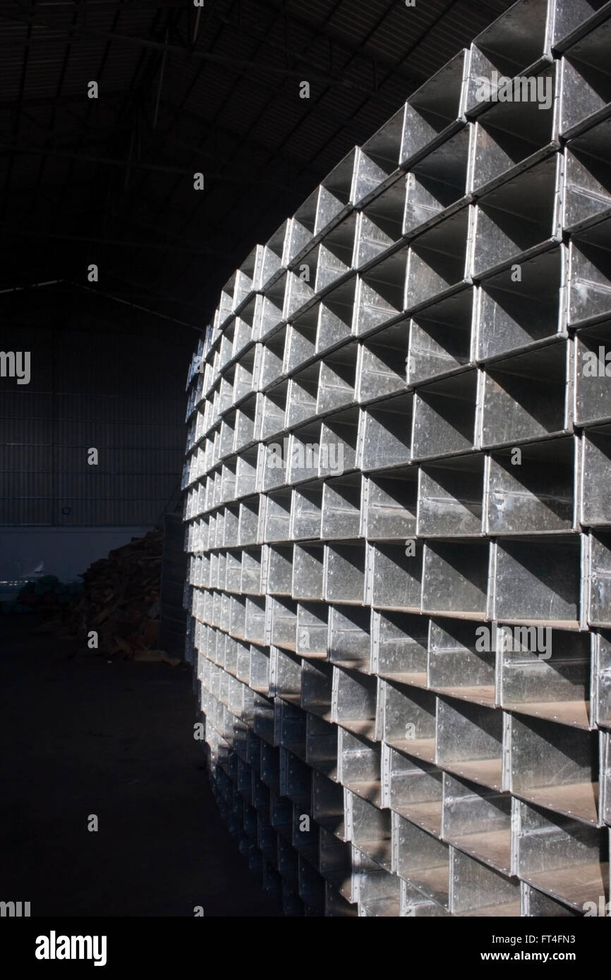 Manufactured sheet metal cubes are stacked at the Im Chheng factory in ...