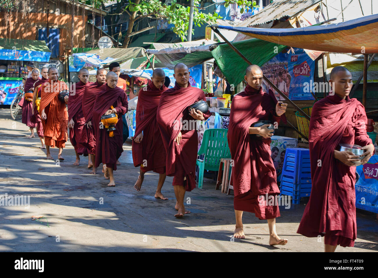 Monks on their morning alms rounds, Yangon, Myanmar Stock Photo - Alamy