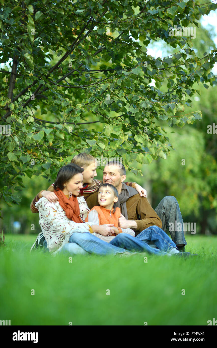 Family resting in park Stock Photo - Alamy
