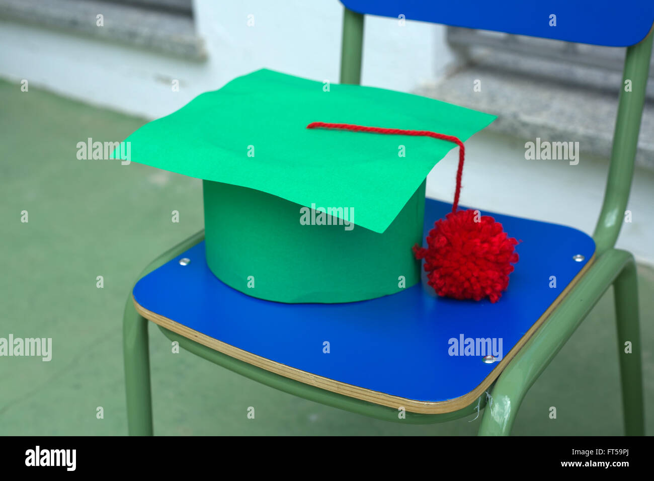 Green cap over preschool chair during nursery graduation day Stock ...