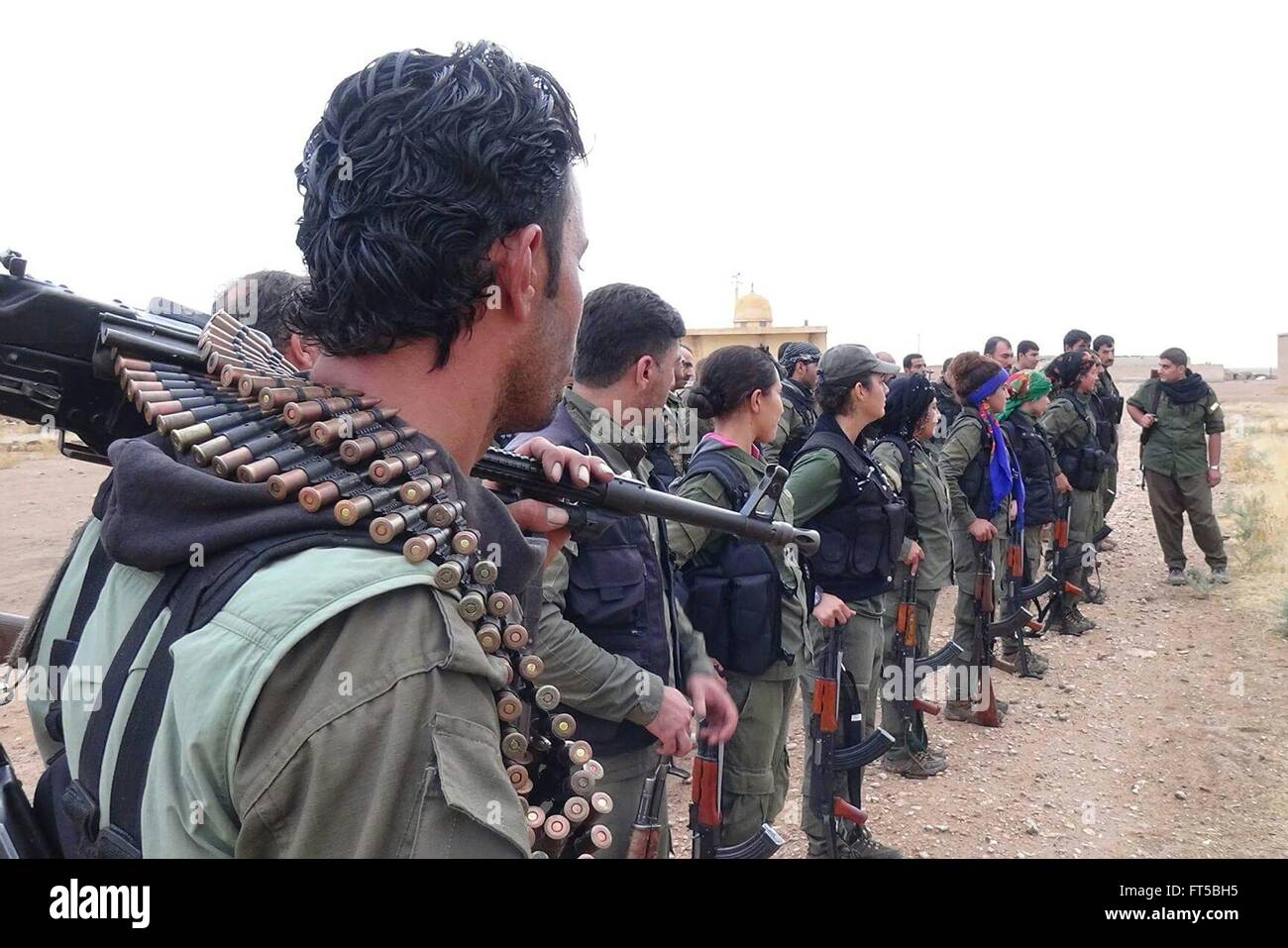 Guerrilla fighters with the Kurdish YPG line up before an operation ...