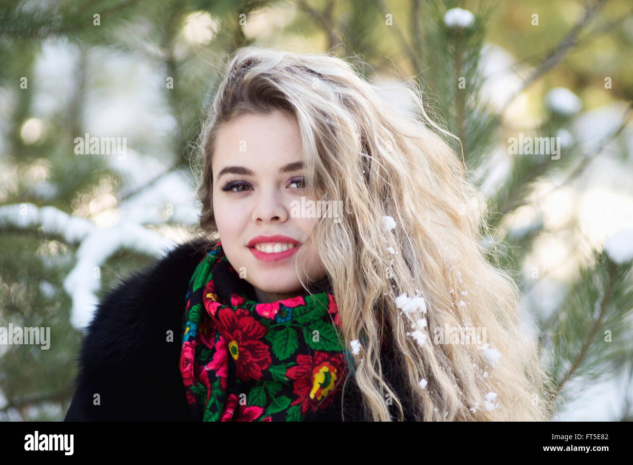 Portrait of young woman blowing snow hi-res stock photography and ...