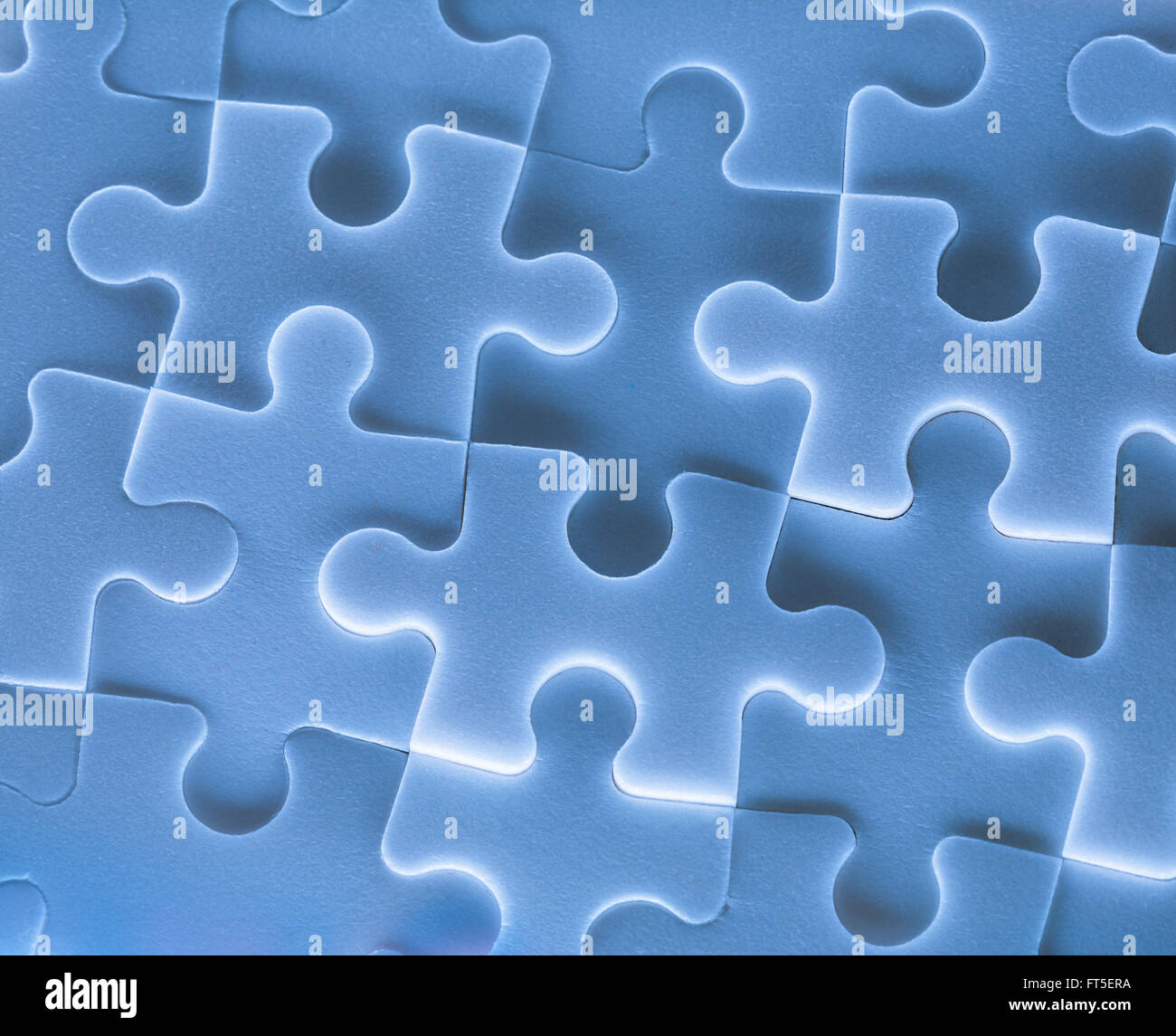 Jigsaw puzzle pieces as background in closeup Stock Photo - Alamy