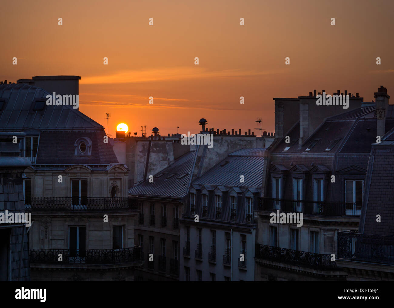 Sunrising over roof tops and chimneys in Paris city Stock Photo - Alamy
