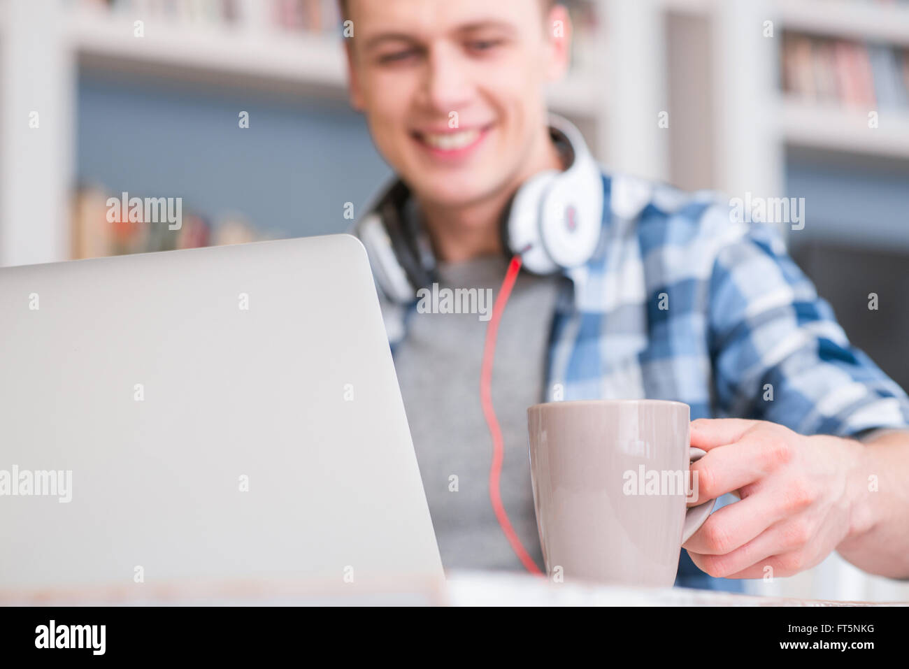 Cheerful guy resting at the table Stock Photo - Alamy
