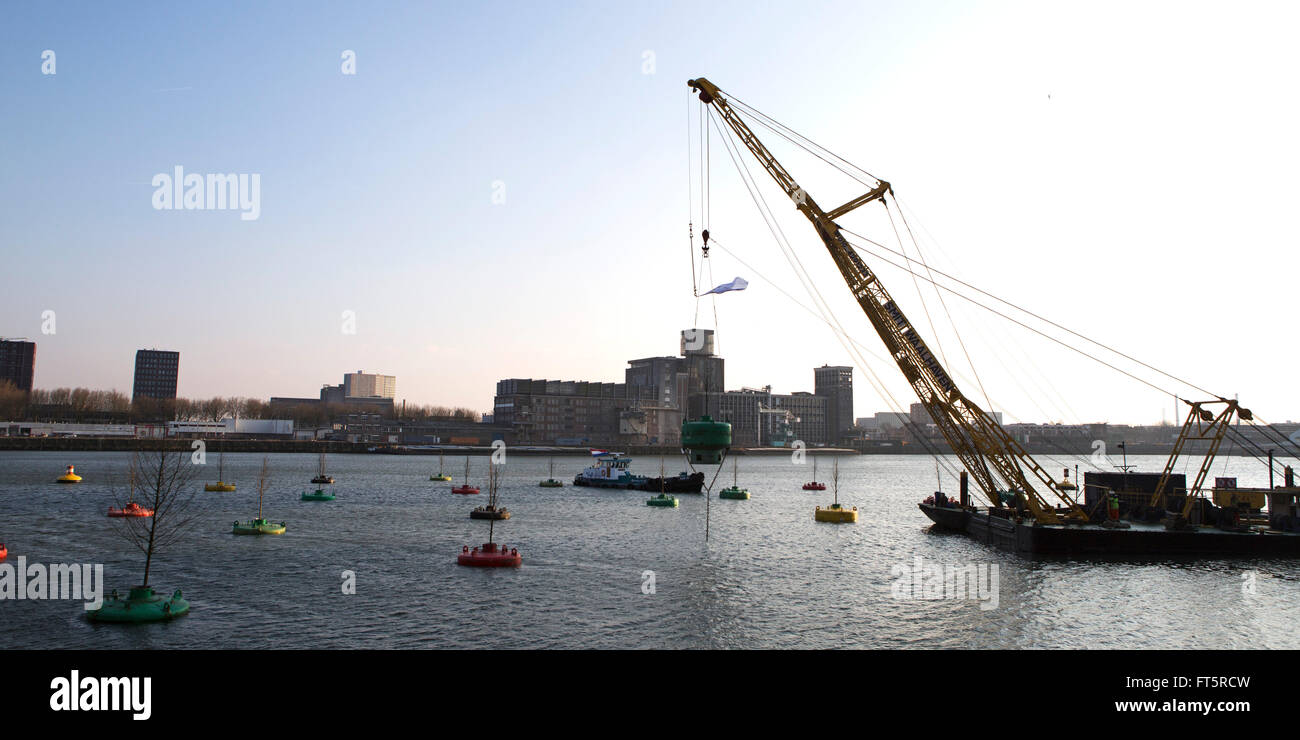 The final buoy is lowered into place at the Bobbing Forest in Rotterdam ...