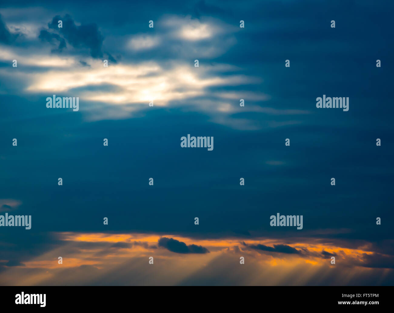 Sunset with sun rays Stock Photo - Alamy