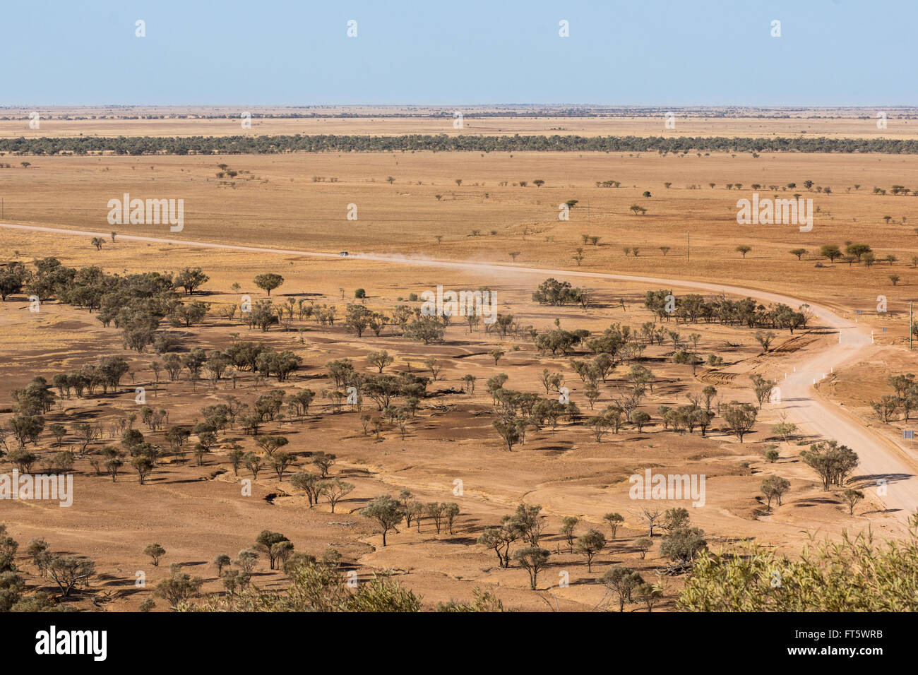 Car driving on dry, dusty road in drought conditions in western ...