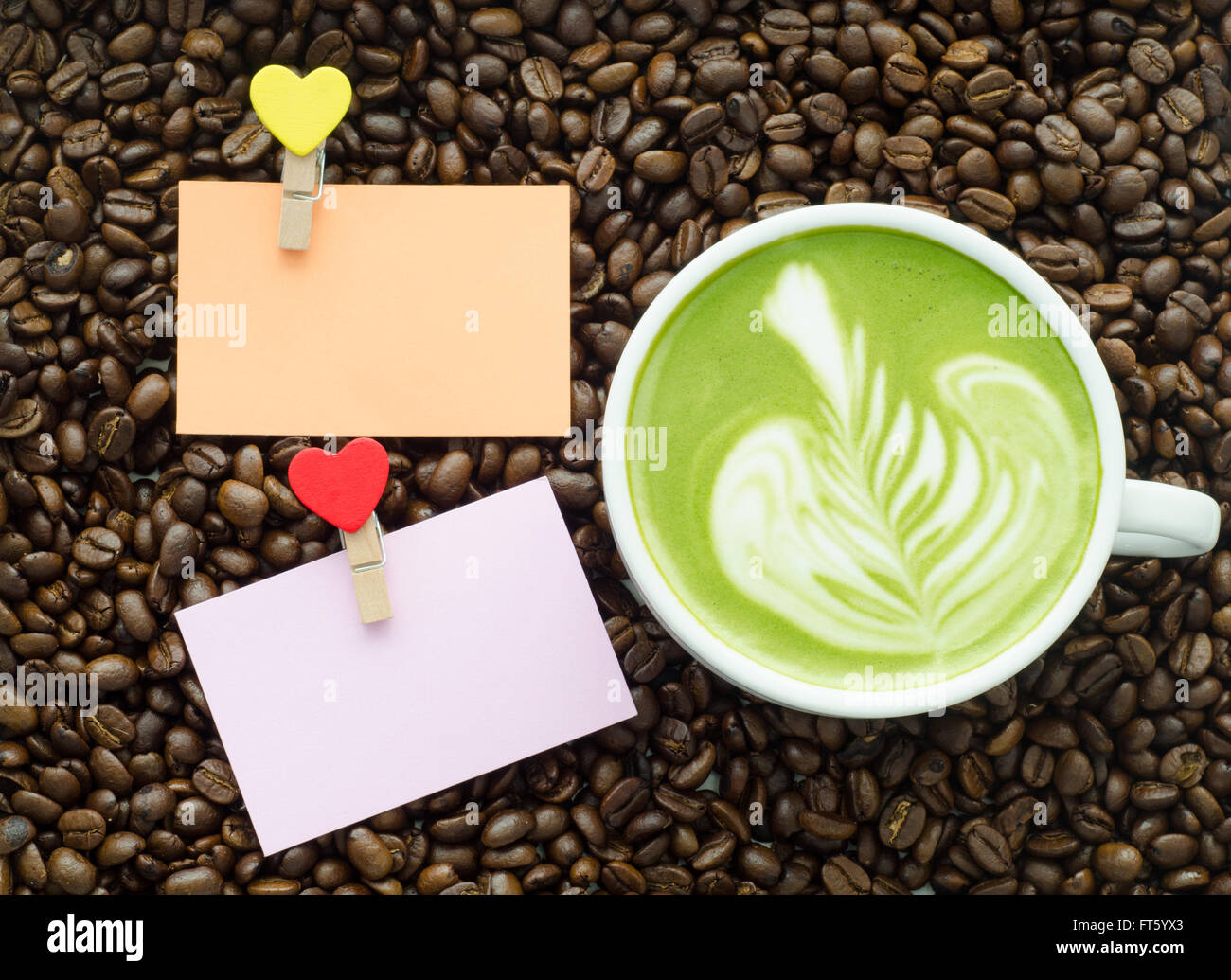 beautiful green tea and clip note on coffee bean background Stock Photo ...