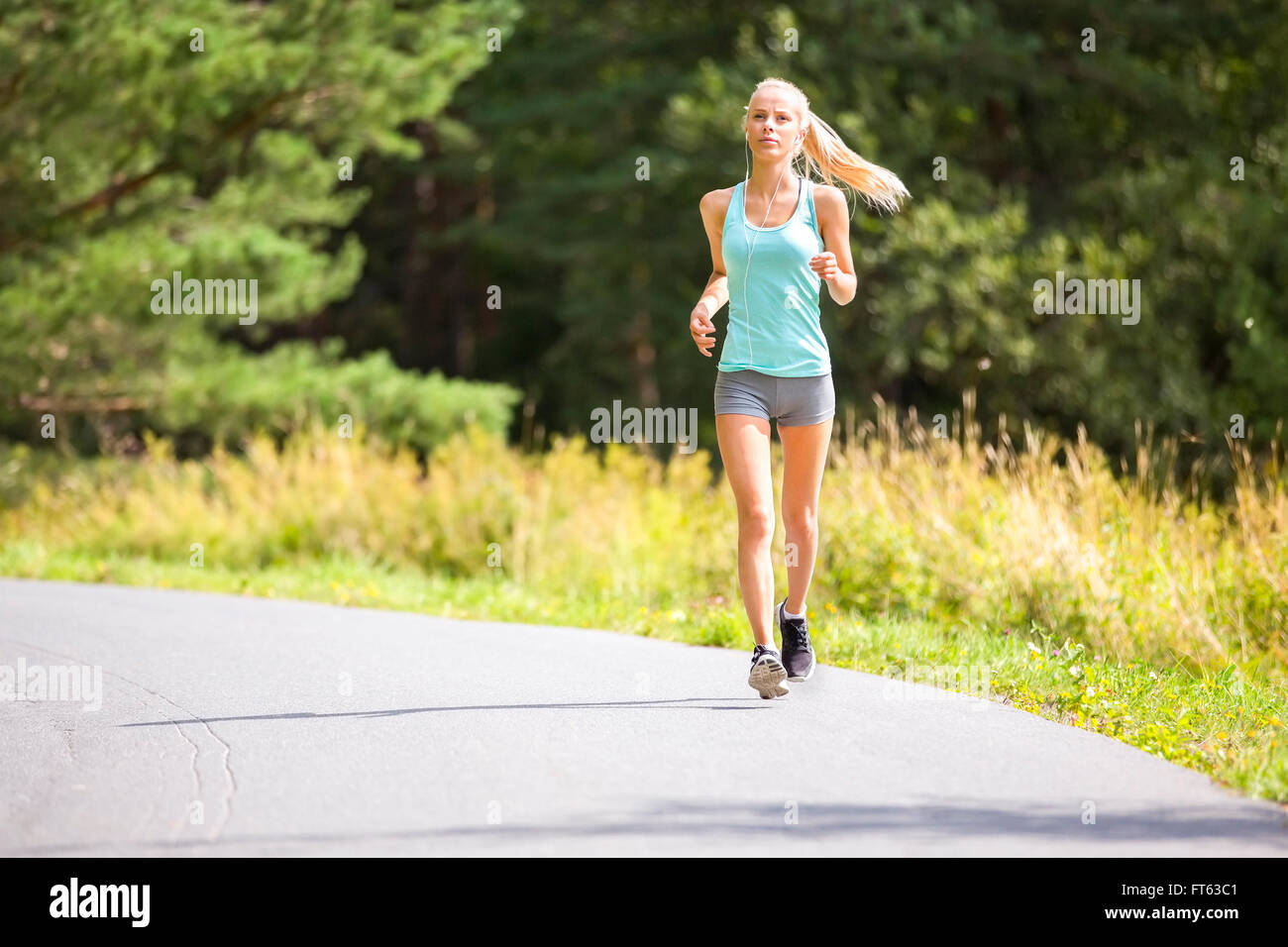 Slim blonde running hi-res stock photography and images - Alamy
