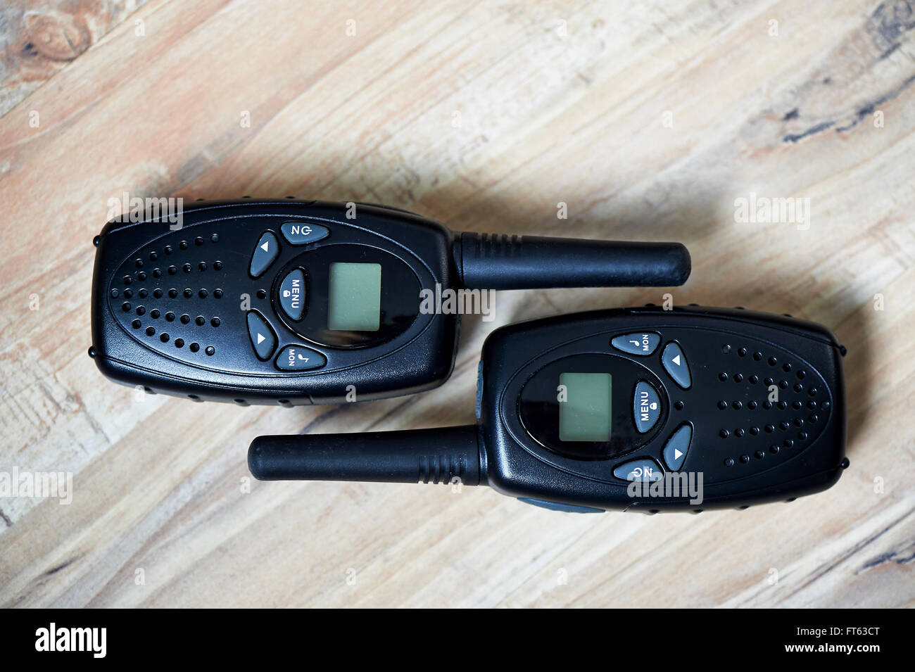 Two black compact professional portable radio sets with maps Stock ...