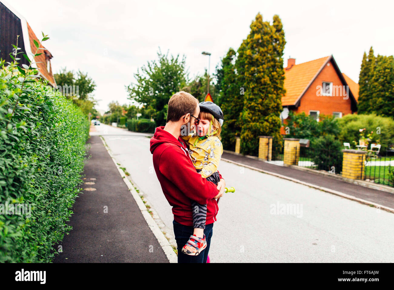Father carrying crying child hi-res stock photography and images - Alamy