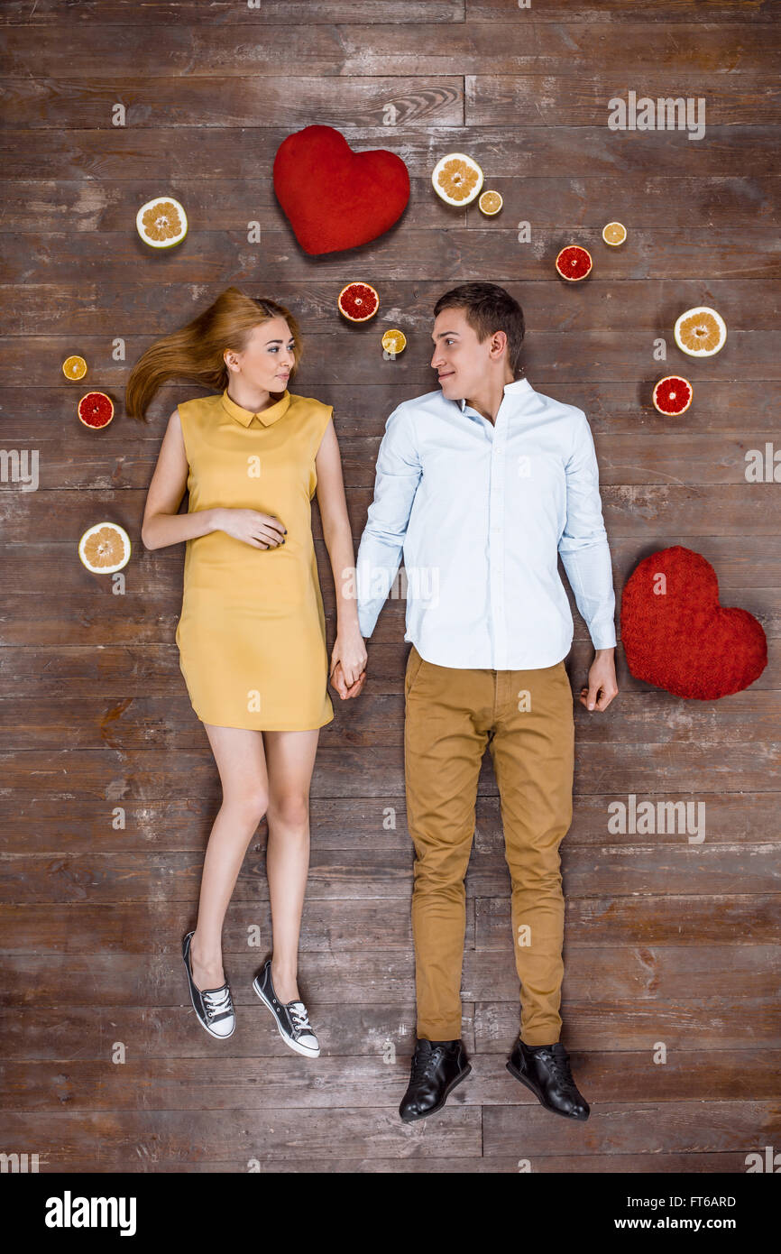Top view photo of couple on wooden floor Stock Photo - Alamy