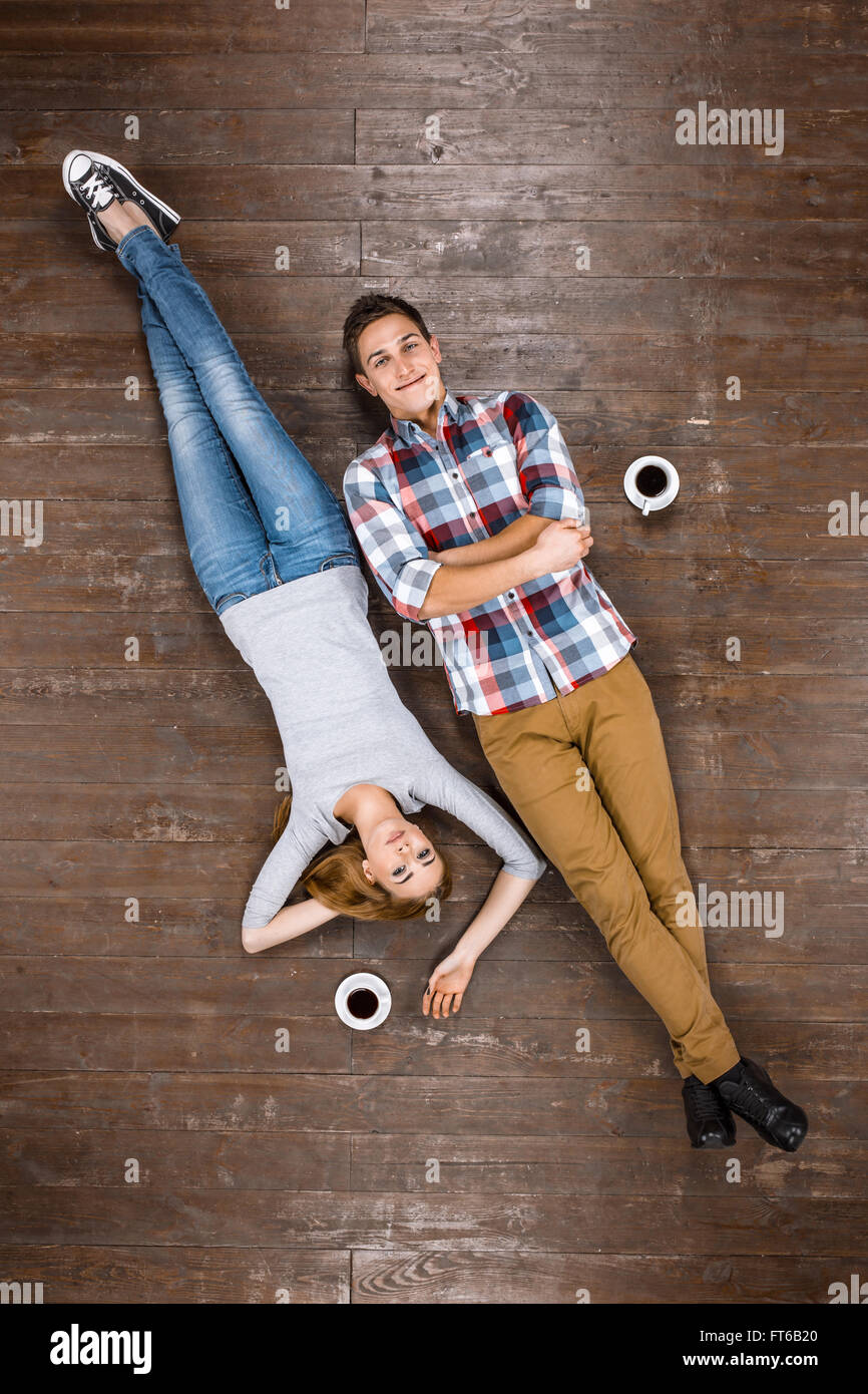 Top view photo of couple on wooden floor Stock Photo - Alamy