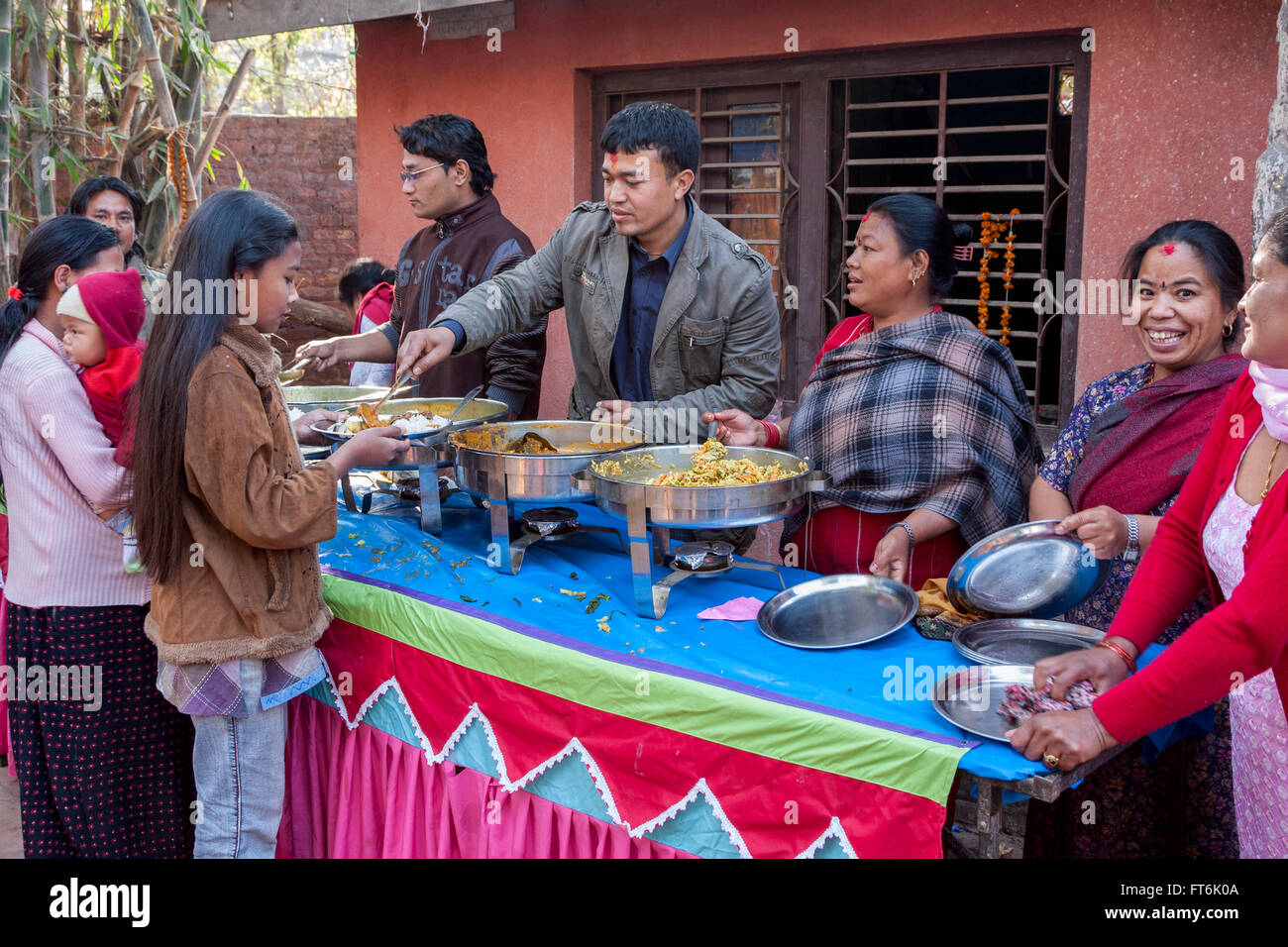 Nepal, Kathmandu. Members of a Neighborhood Hindu temple Serve a Buffet ...
