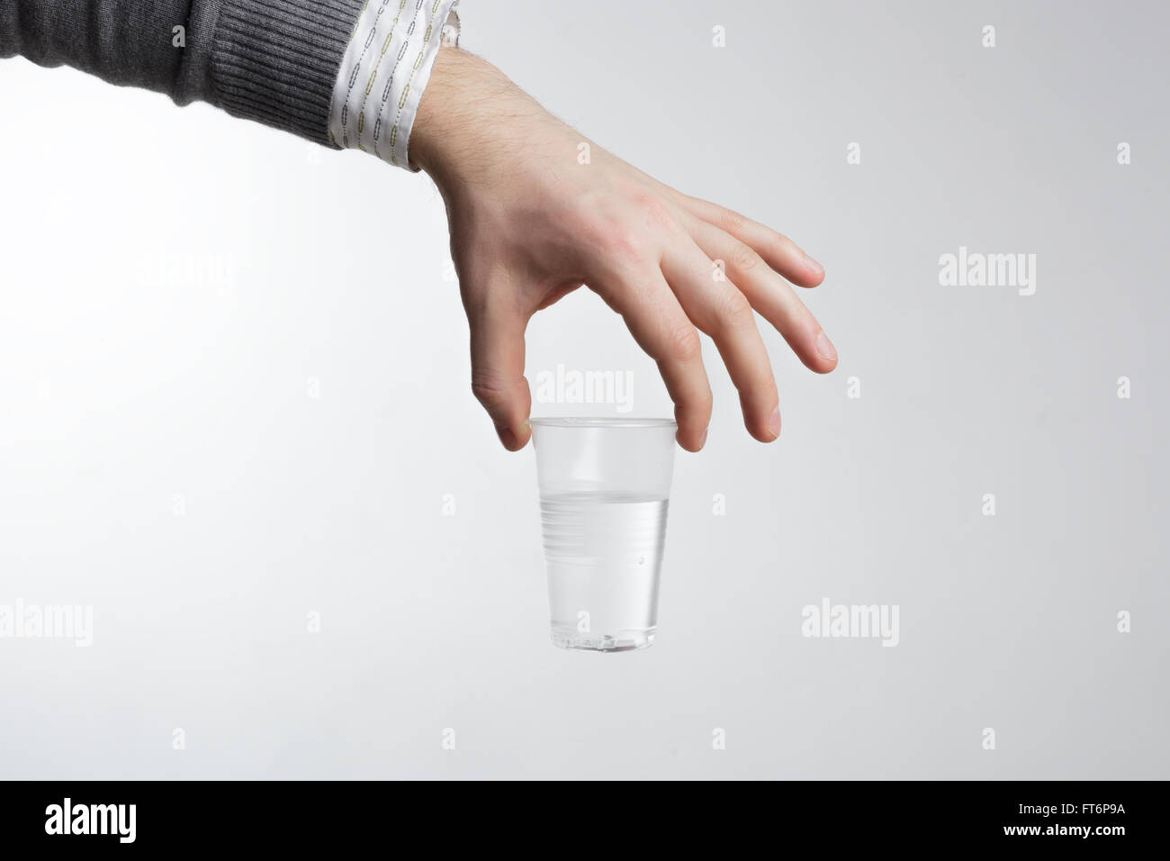 Man holding plastic cup with clean water Stock Photo - Alamy