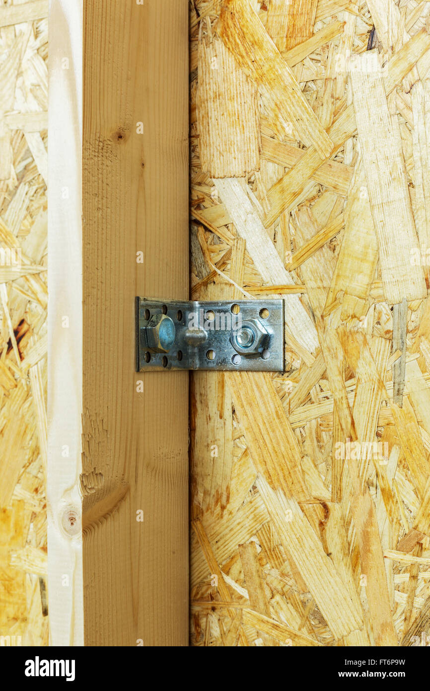 Home construction. Connection of two beams Stock Photo - Alamy