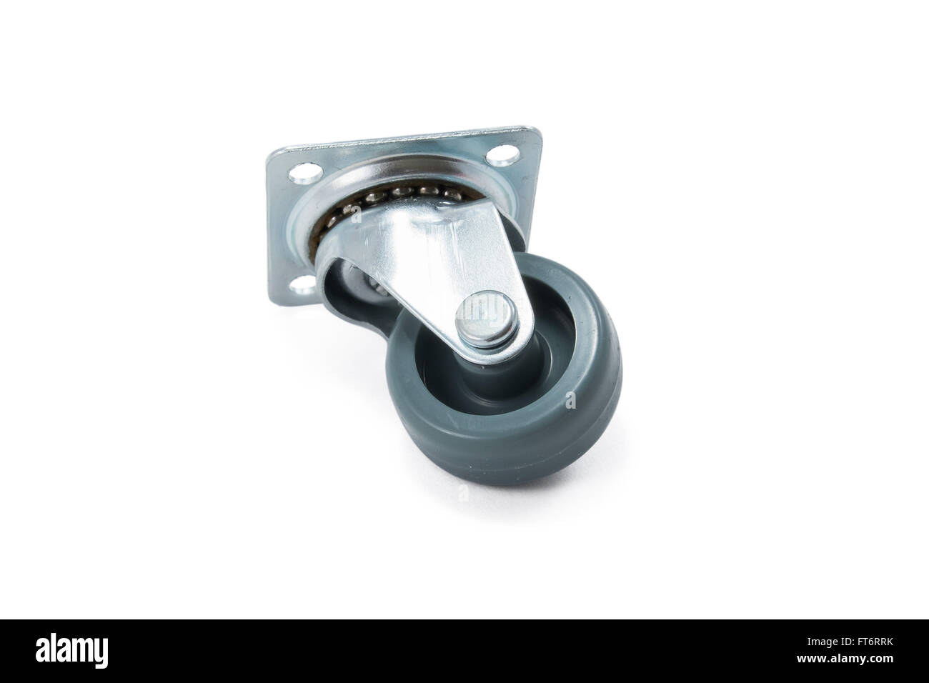 Caster wheel lying on white surface Stock Photo - Alamy