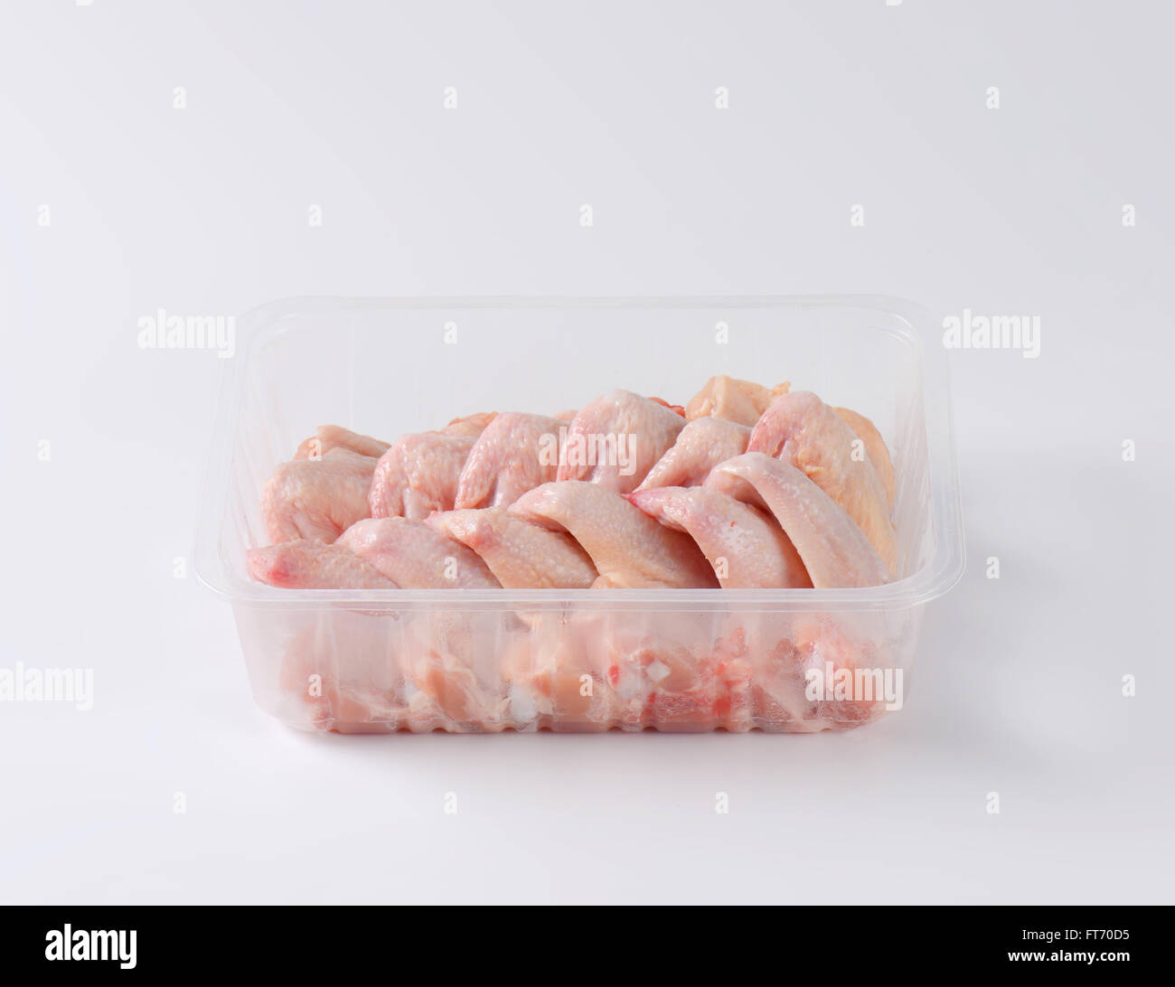 raw chicken wings in plastic container Stock Photo - Alamy