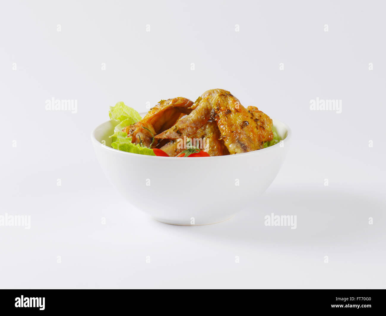 roasted chicken wings in white bowl Stock Photo - Alamy