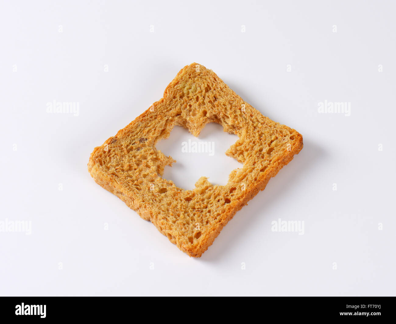 Slice of bread with cut out four leaved clover shape Stock Photo - Alamy