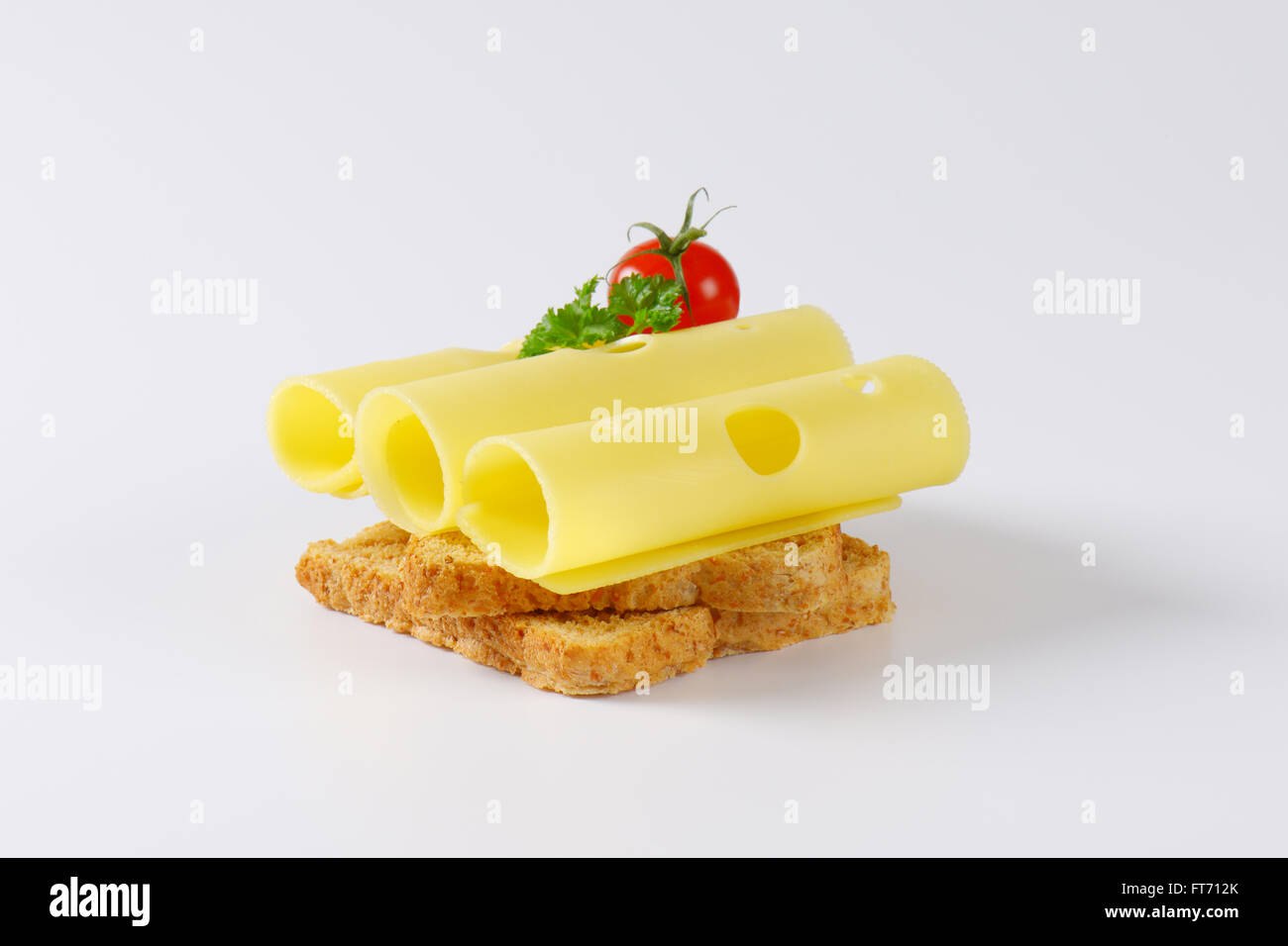 slices of whole grain bread with emmenthaler cheese Stock Photo - Alamy