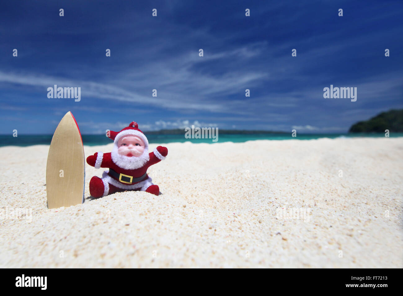 Santa Claus surfer on sand at tropical ocean beach, Christmas and New ...